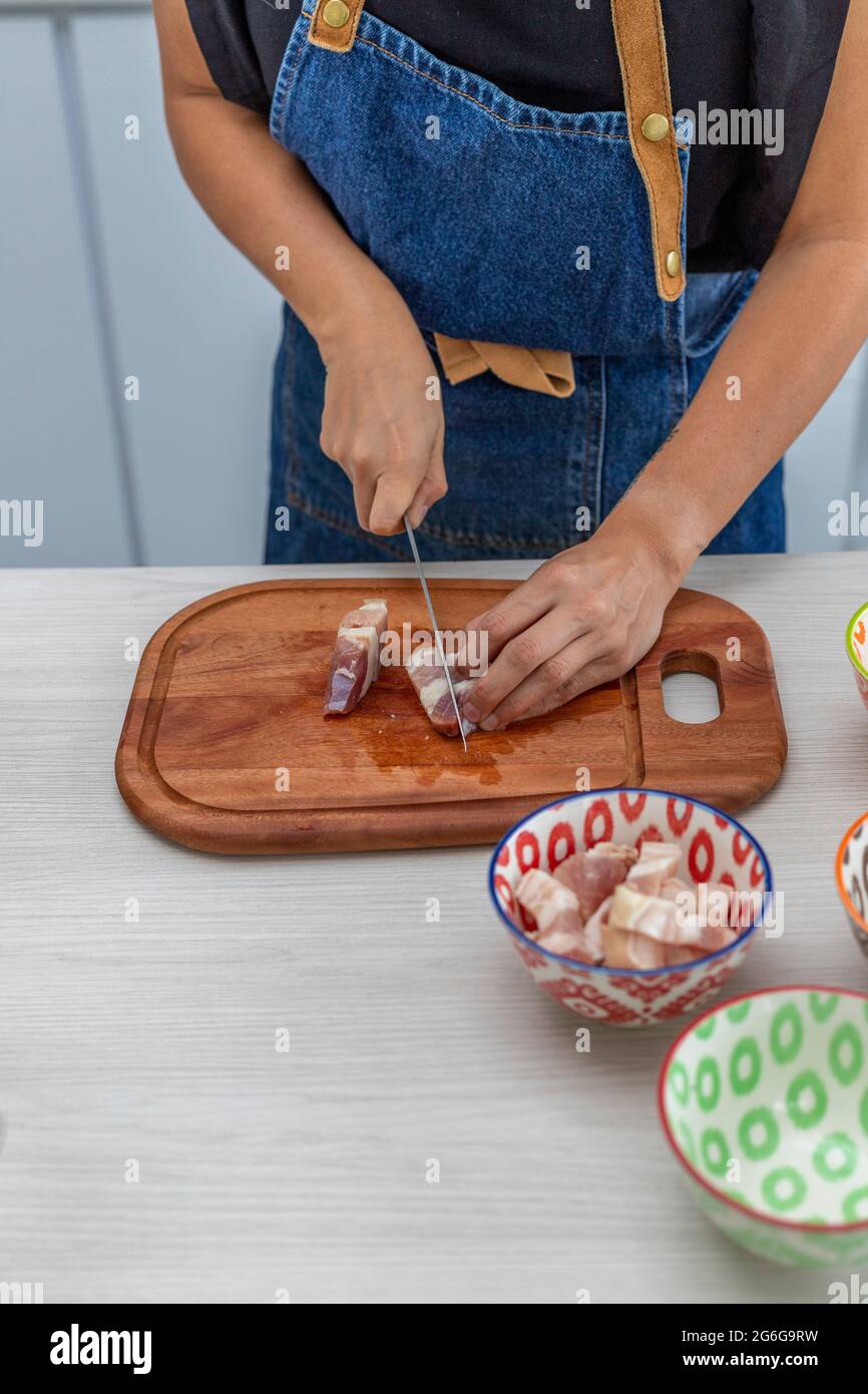 Cook woman meat hi-res stock photography and images - Alamy