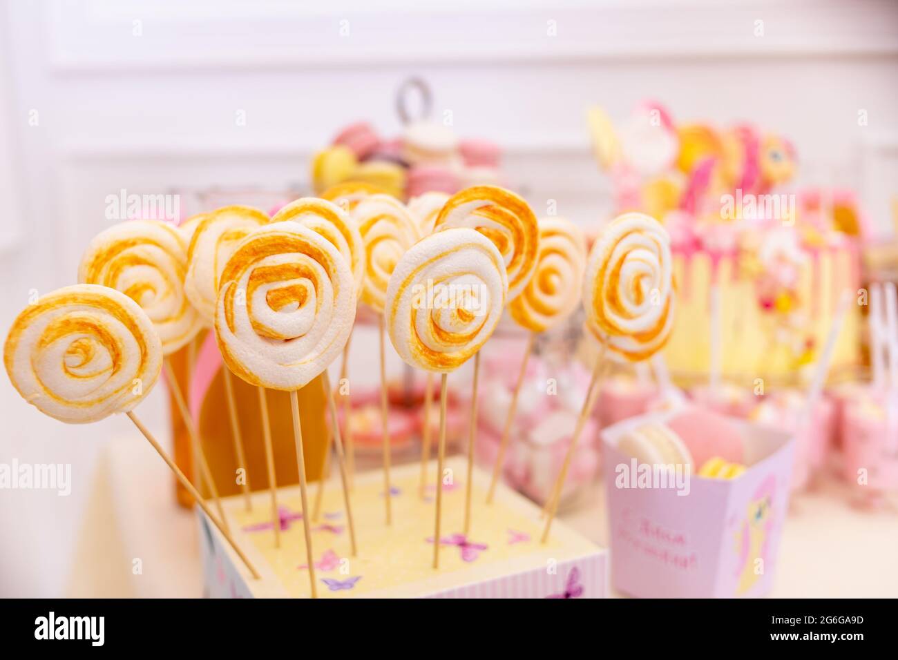 Candy jar and fancy milk bottles for drinks on a dessert table at ...