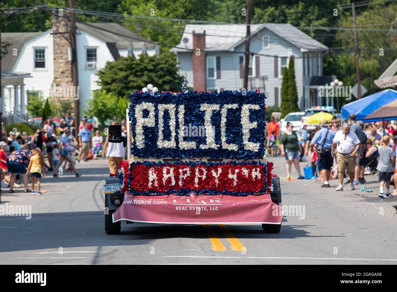 A local real estate firm's float during the Independence Day parade ...