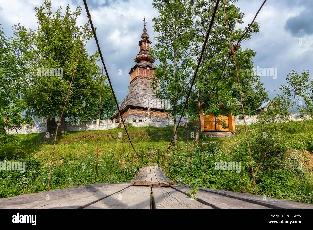 Old wooden church against dramatic sky, historic architecture, religion ...