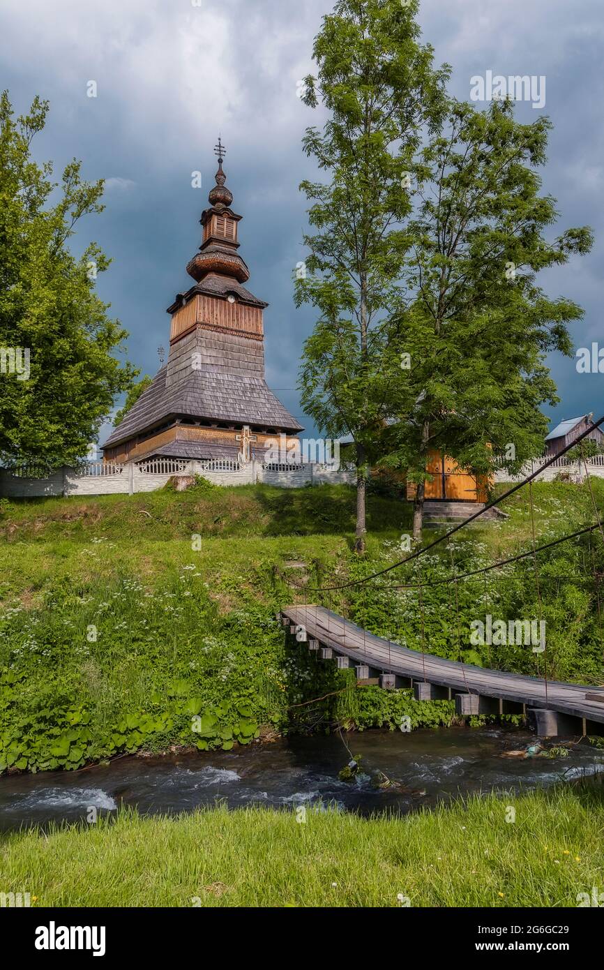 Old wooden church against dramatic sky, historic architecture, religion ...