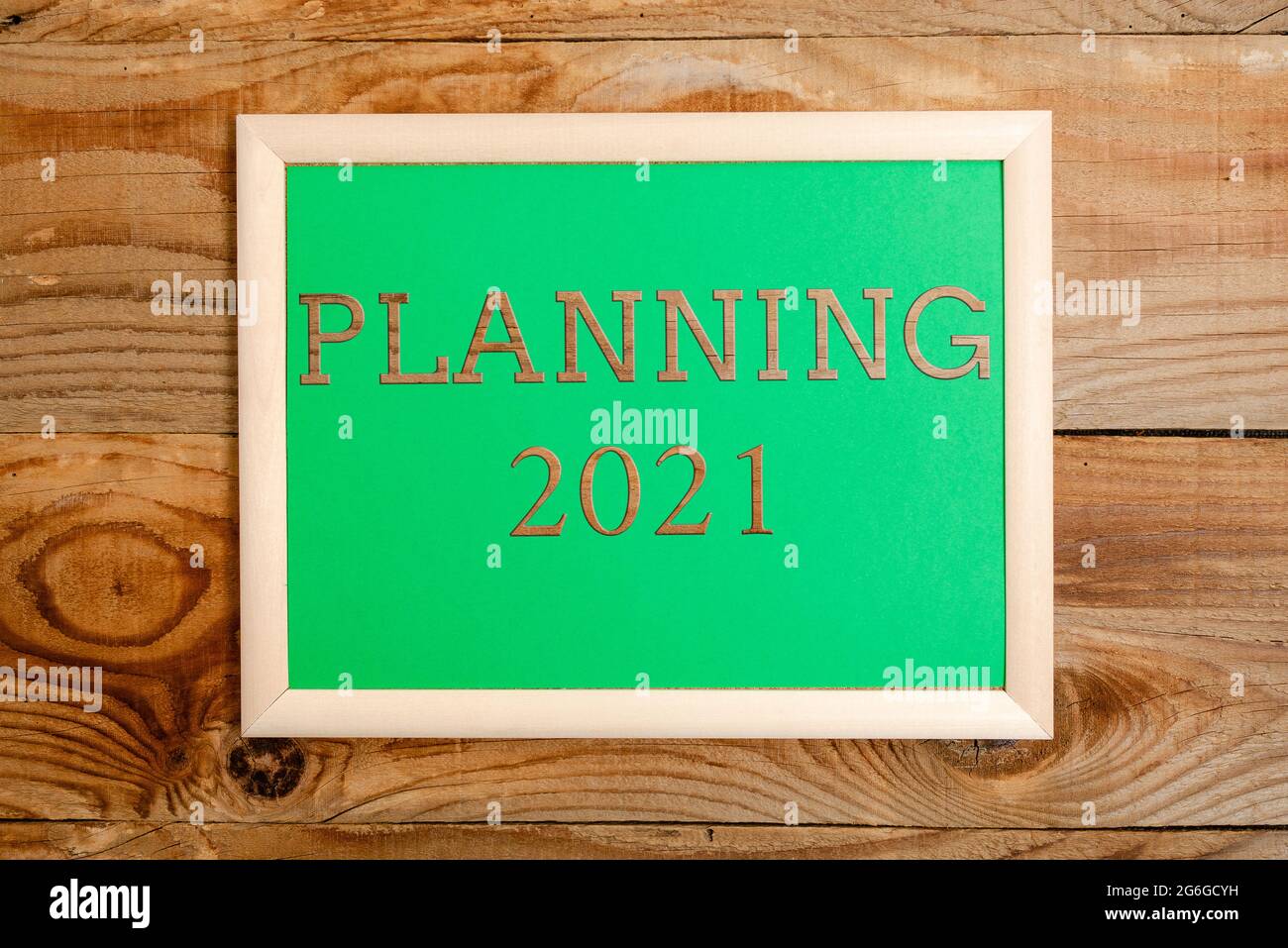 Hand writing sign Planning 2021. Concept meaning Begin with end in the ...
