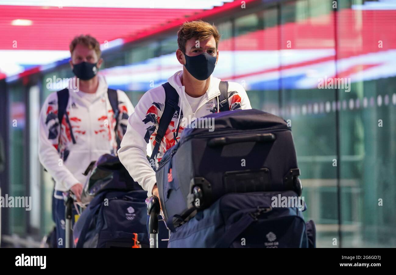 Team GB's Dylan Fletcher (right) arrives at Heathrow Terminal 5 before ...