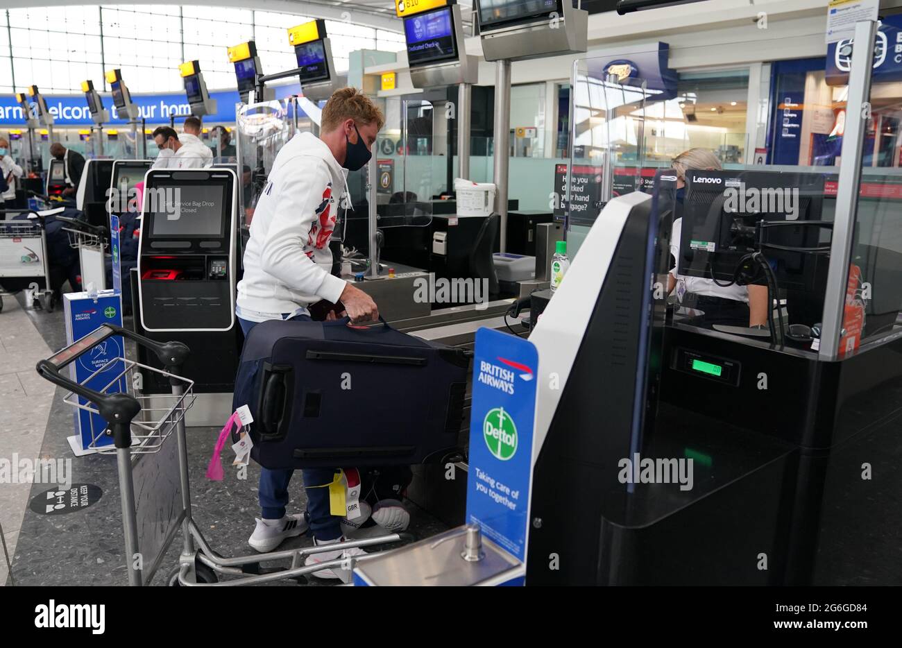 Members of the Team GB Sailing team check in as they arrive at Heathrow ...