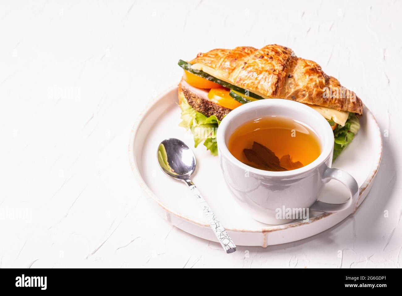 Healthy breakfast concept. Morning good mood with tea and croissant ...