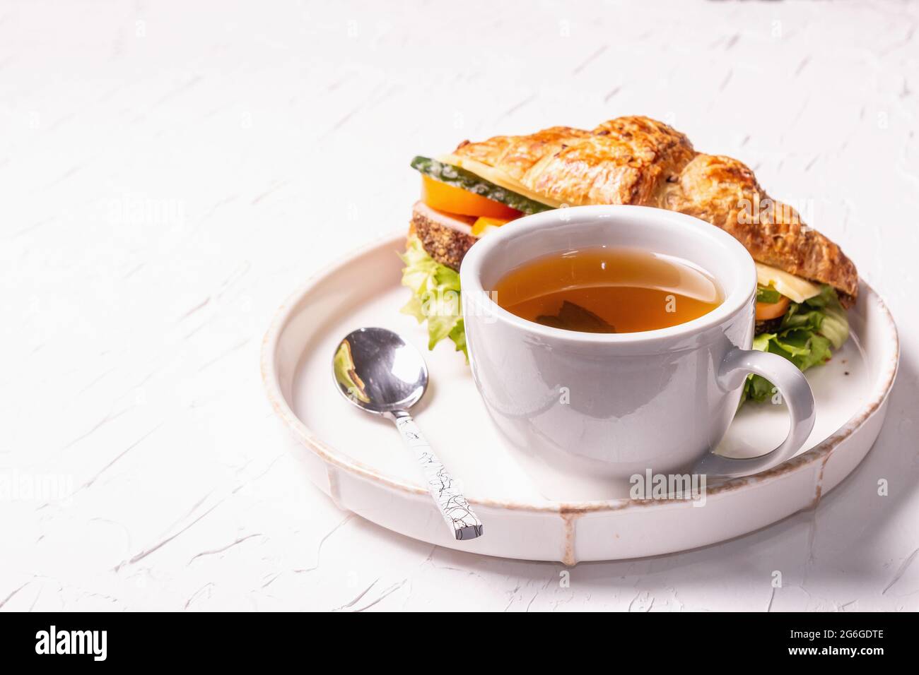 Healthy breakfast concept. Morning good mood with tea and croissant ...