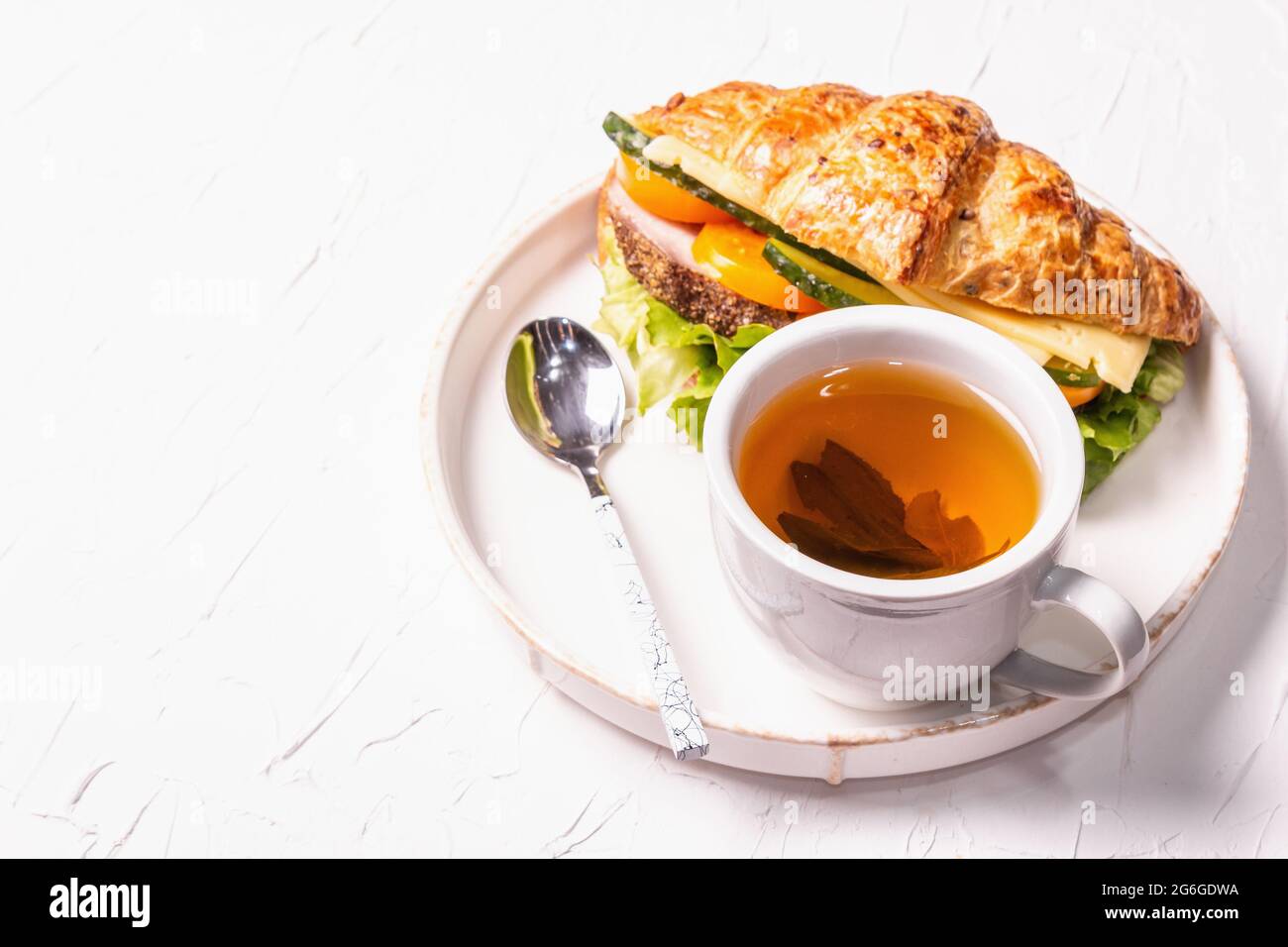 Healthy breakfast concept. Morning good mood with tea and croissant ...