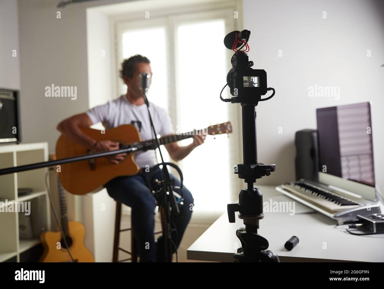guitar player recording at home studio Stock Photo - Alamy