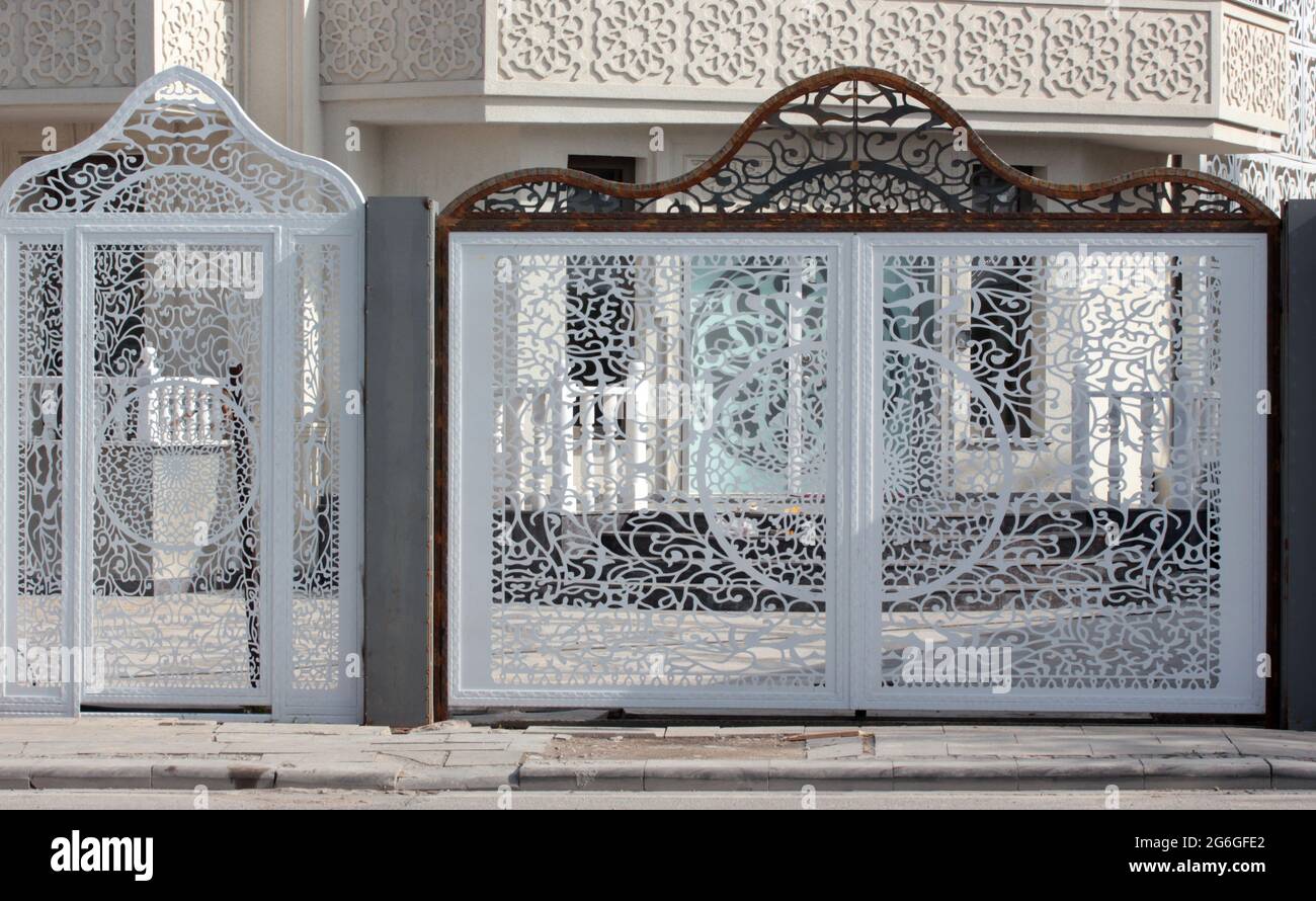 White wrought iron gate of modern villa Stock Photo - Alamy