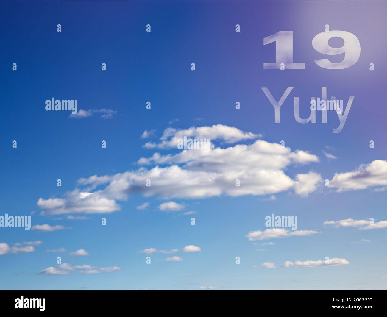 July 19, 19th day of month. White clouds in blue skies on sunny day ...