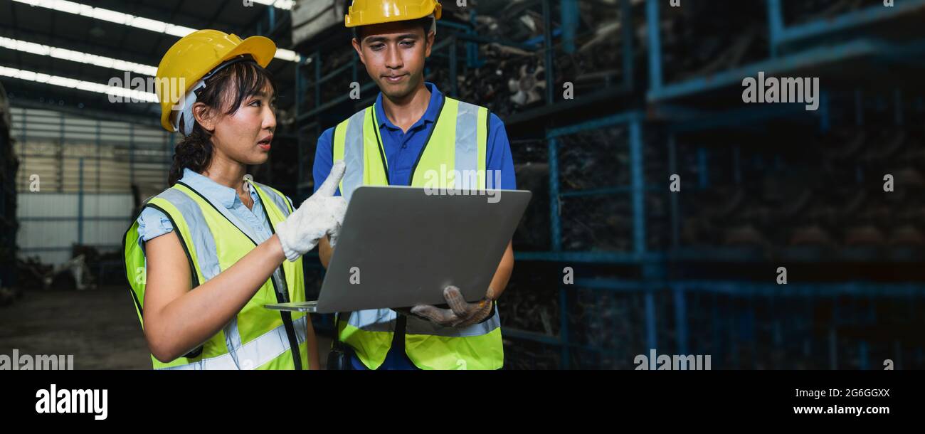 Two engineers worker check and working on laptop in industry planning ...