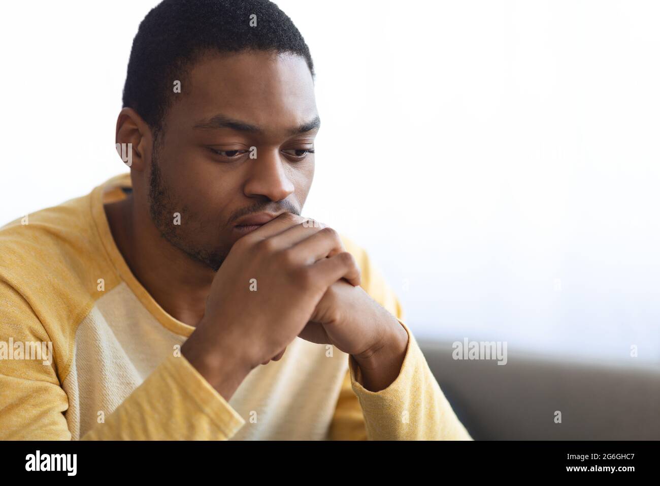 Lonely african american man sitting hi-res stock photography and images ...