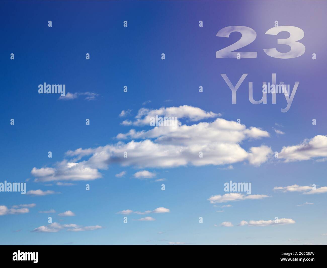 July 23, 23rd day of month. White clouds in blue skies on sunny day ...