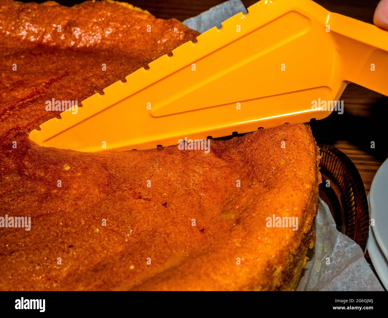 The cake server slowly cuts into the homemade freshly baked stuffed ...