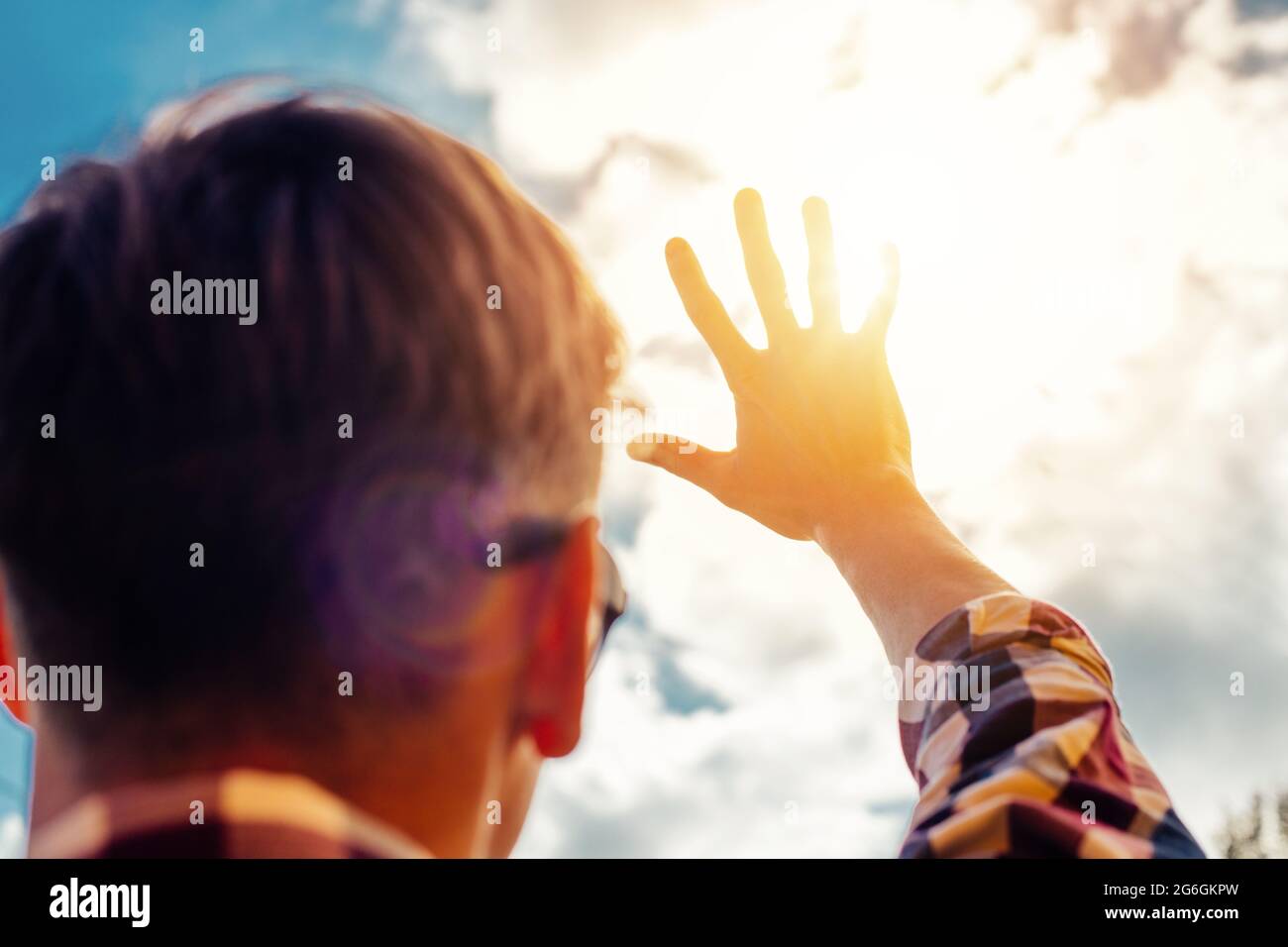 Man's hand covering sunlight, Sun shining through the hand, Human hand ...