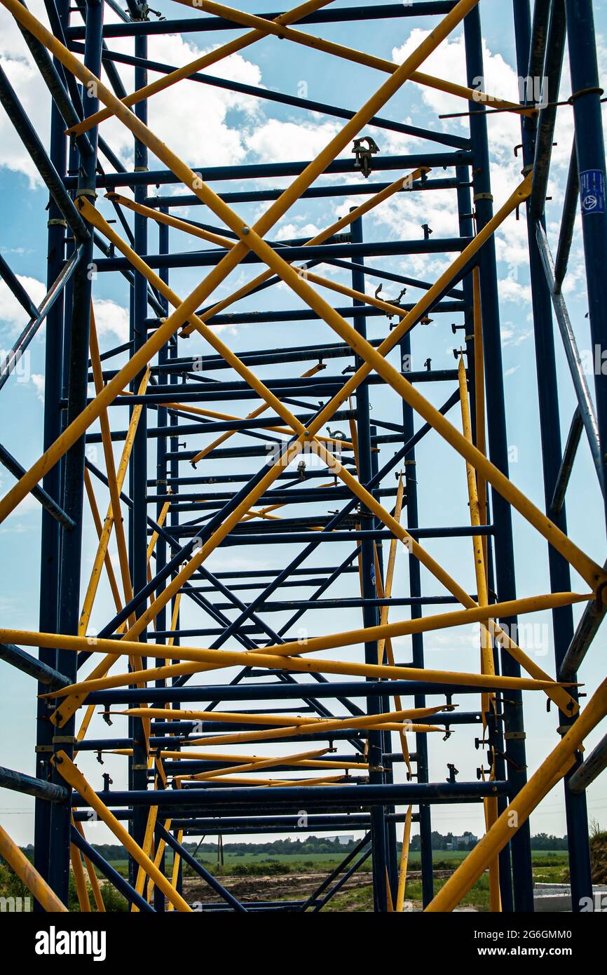 Construction site with scaffolding tower and building. Scaffolding for ...