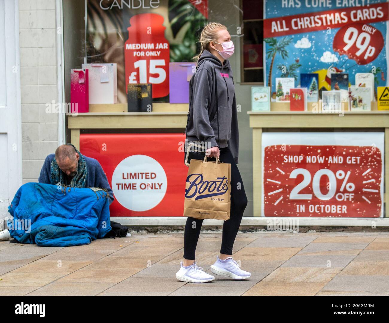 Homeless man sitting outside of shop hi-res stock photography and ...