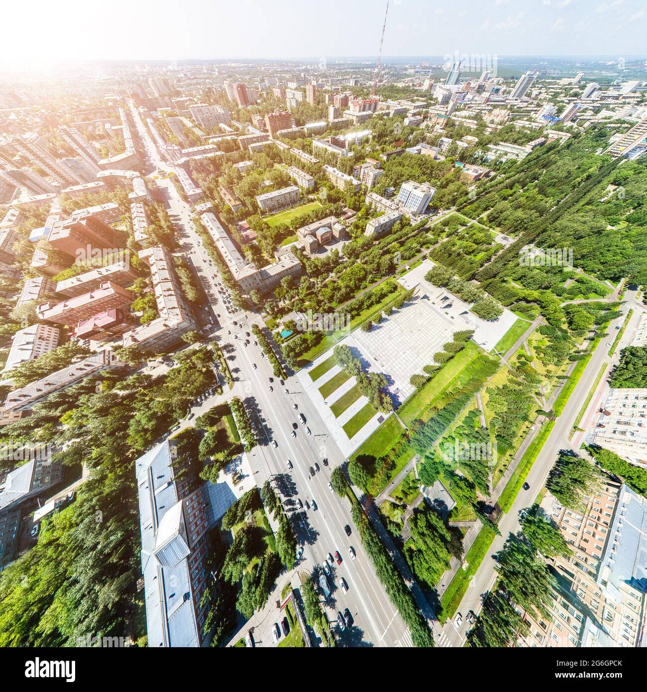 Aerial city view with crossroads, roads, houses, buildings, parks and ...