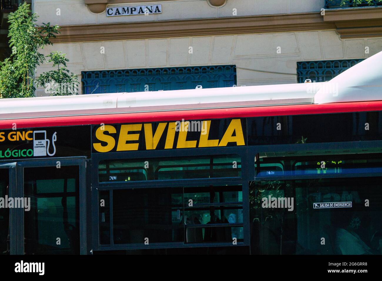 Seville Spain July 05, 2021 Bus driving through the streets of Seville ...
