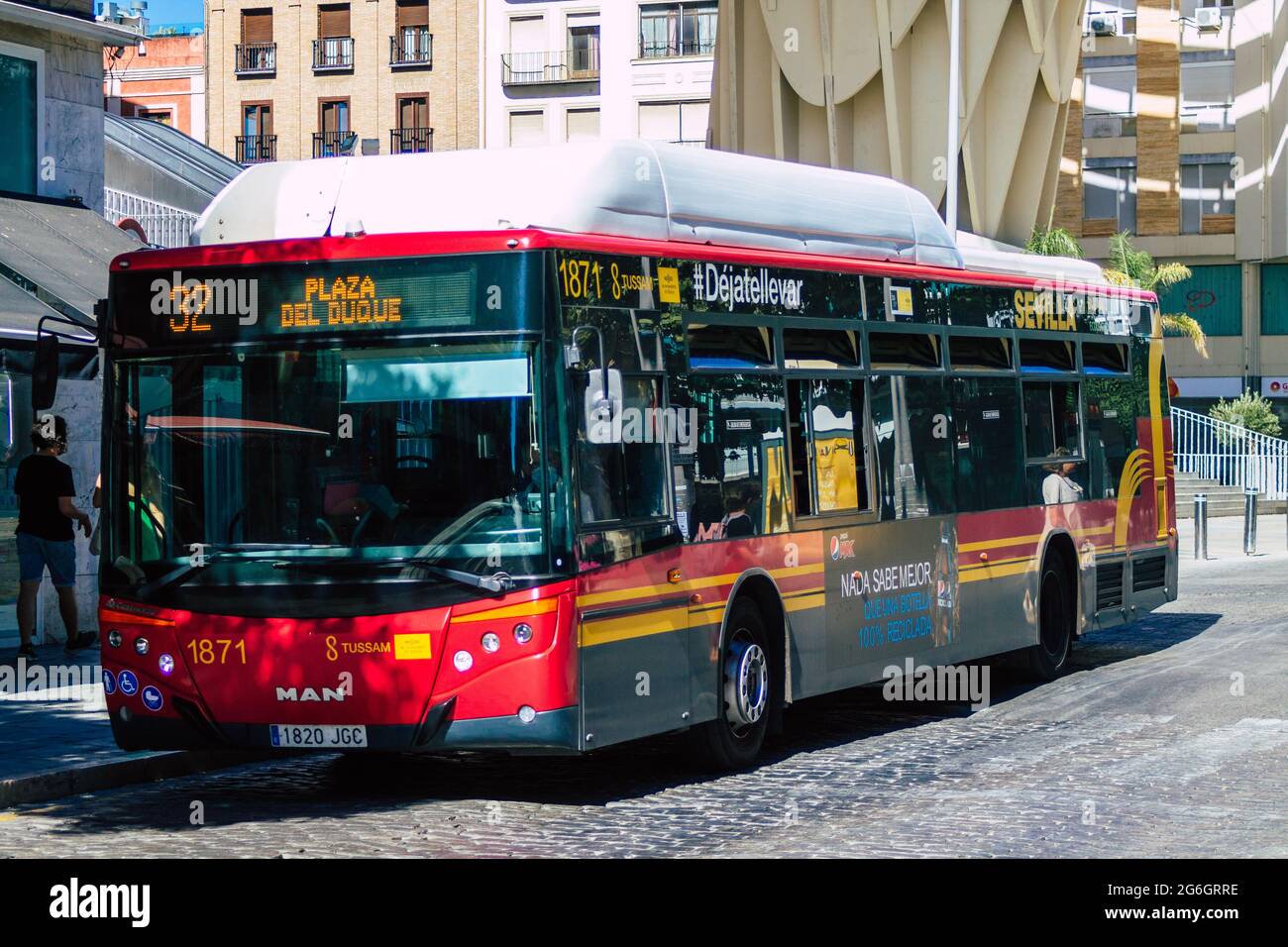 Seville Spain July 05, 2021 Bus driving through the streets of Seville ...