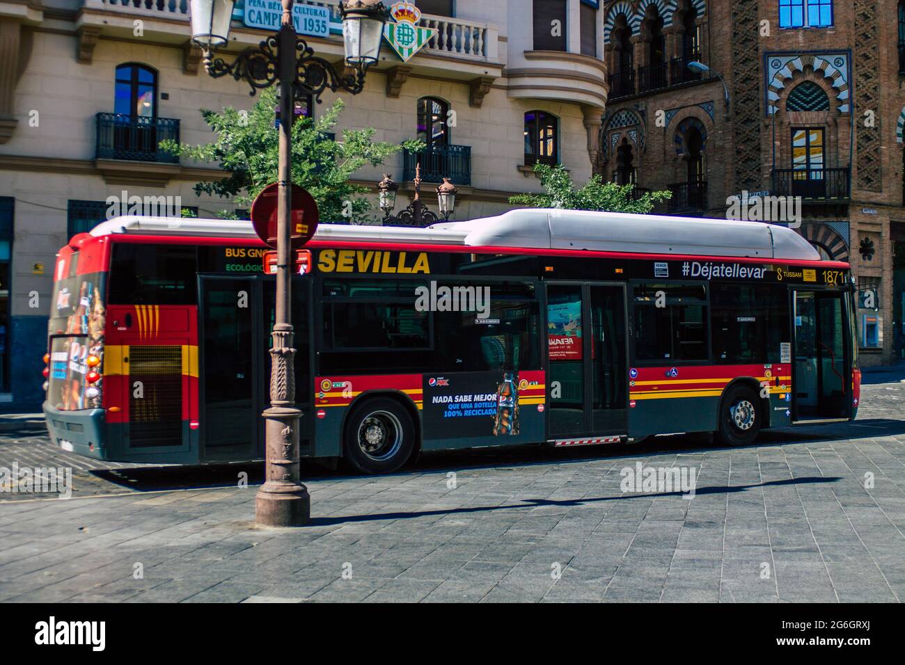 Seville Spain July 05, 2021 Bus driving through the streets of Seville ...