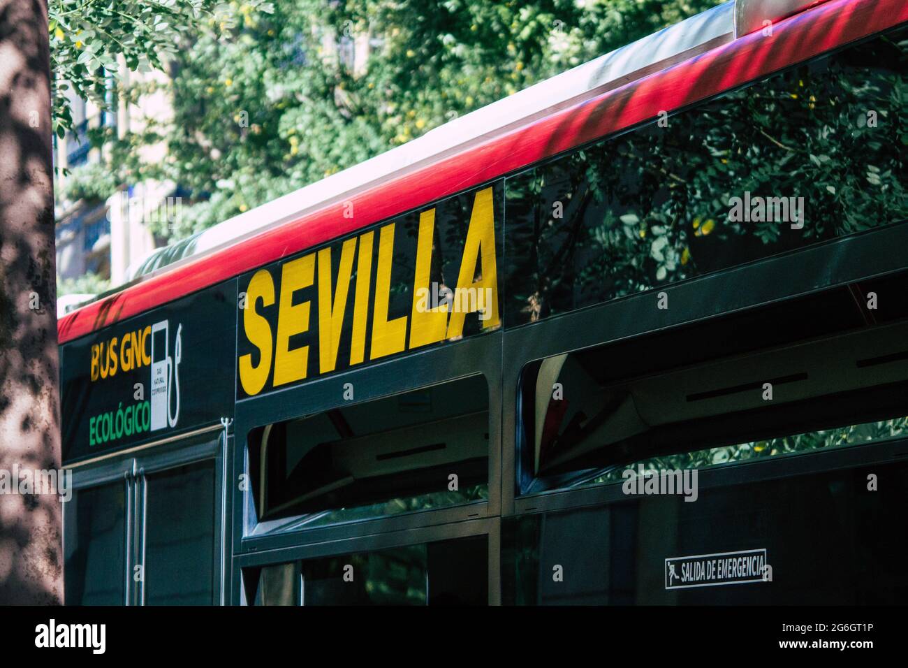 Seville Spain July 05, 2021 Bus driving through the streets of Seville ...