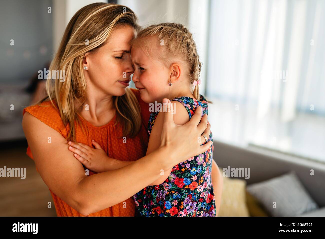 Mother comforting her crying little girl. Parenthood, family, support concept Stock Photo - Alamy