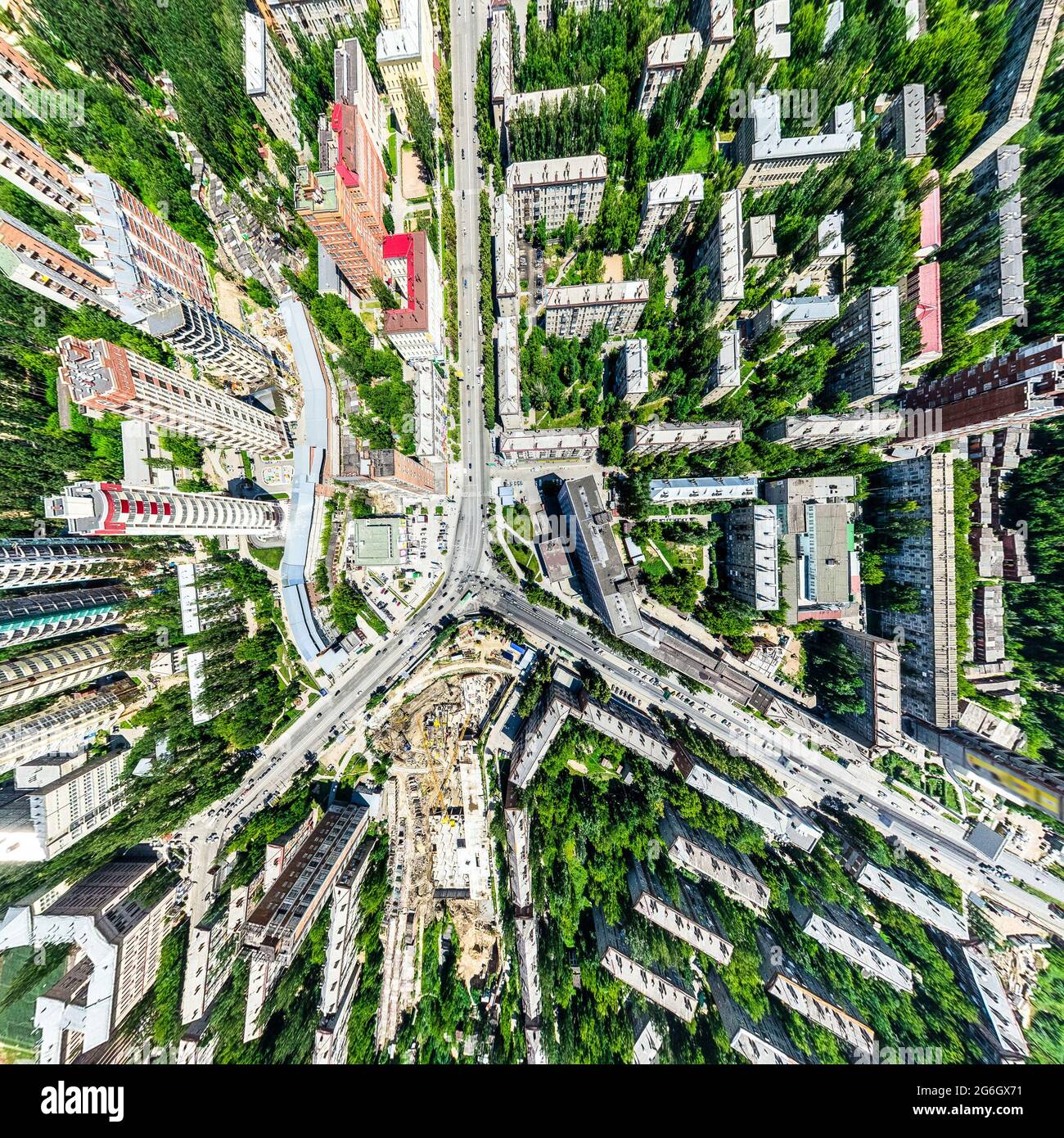 Aerial city view with crossroads and roads, houses, buildings, parks ...