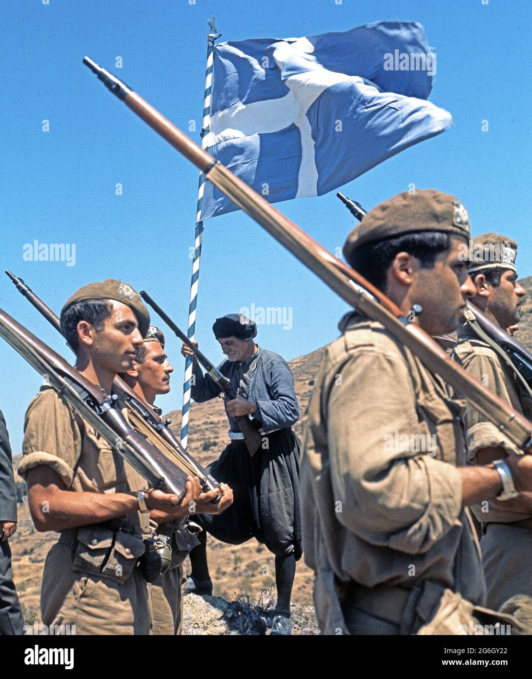 cyprus soldier in front of an old warrior with a greek flag and old ...
