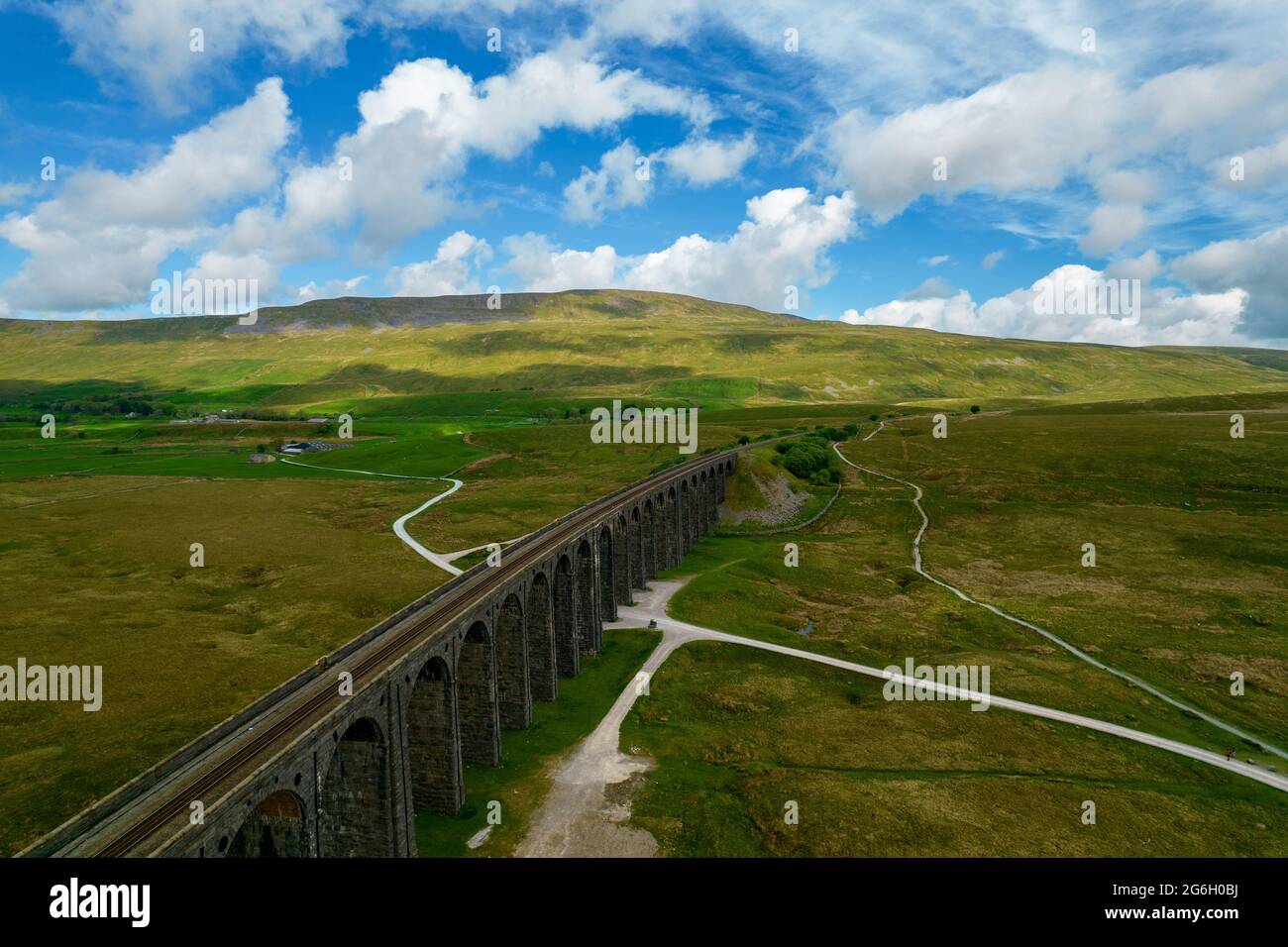 The Ribblehead viaduct in Yorkshire at the bottom of the Whernside ...