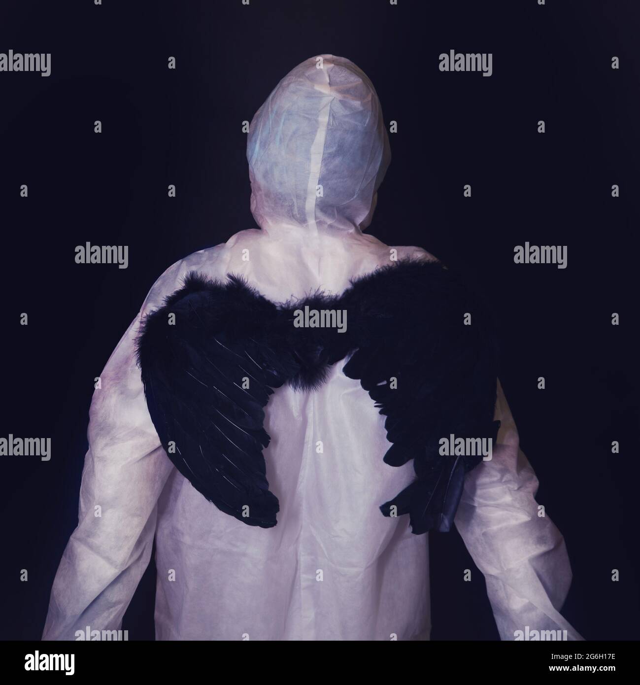 Paramedic with black angel wings on his back on a dark background Stock ...