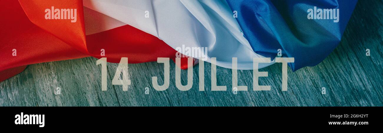 the text 14 juillet, 14 july, the national day of france written in ...