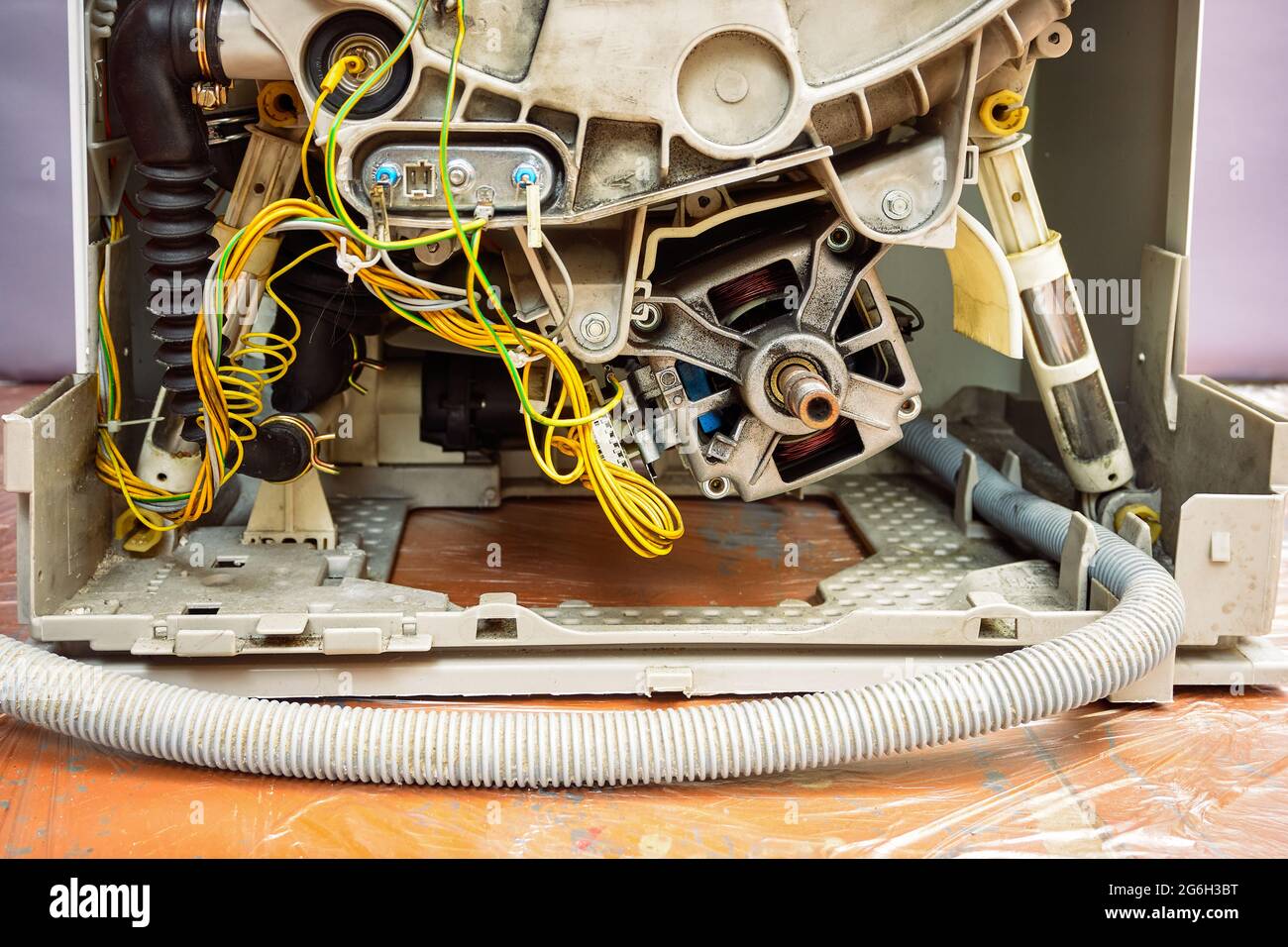 internal parts of the washing machine. electrician, wires, motor, drum ...