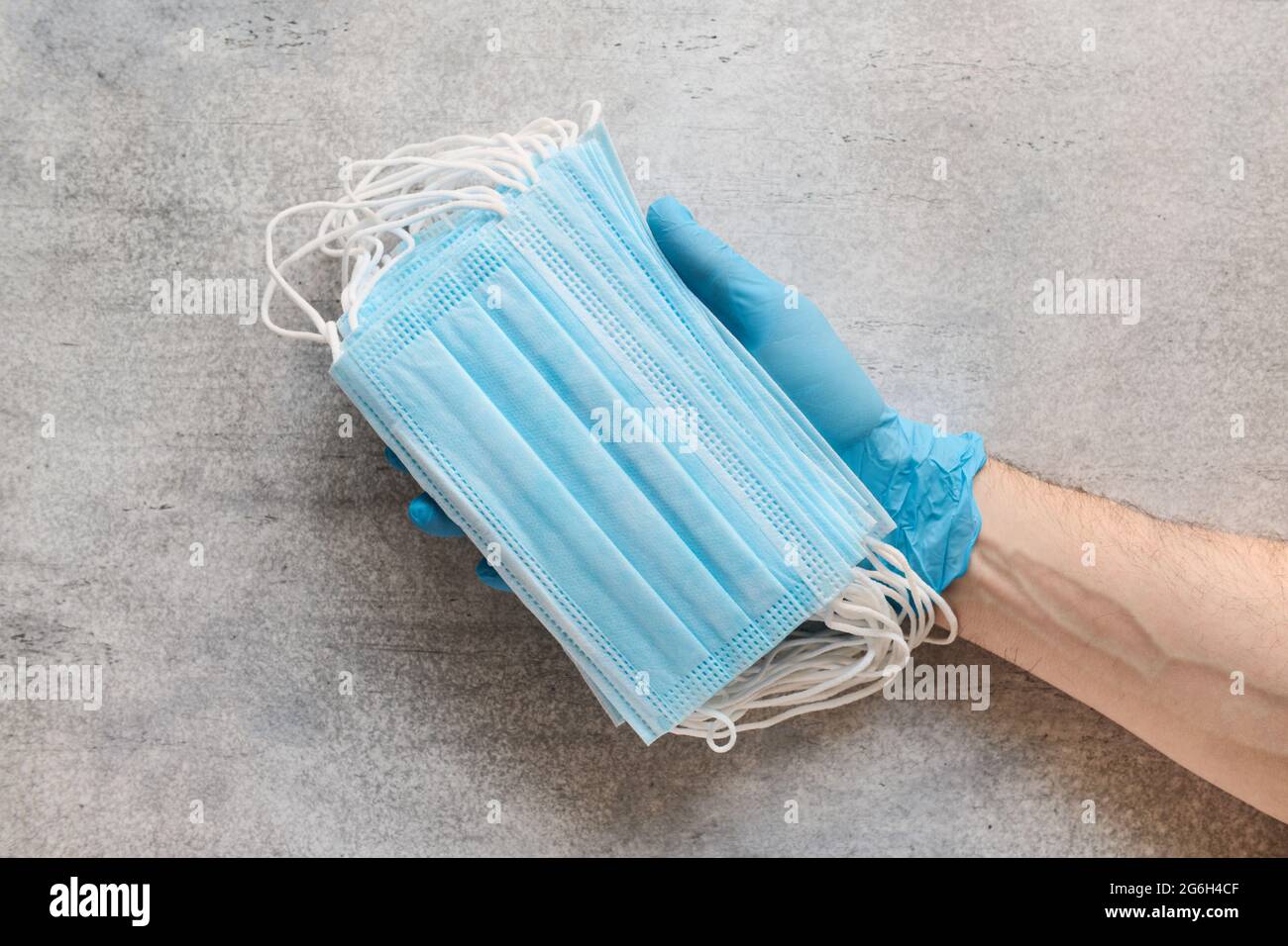 Doctor holds medical protective hi-res stock photography and images - Alamy