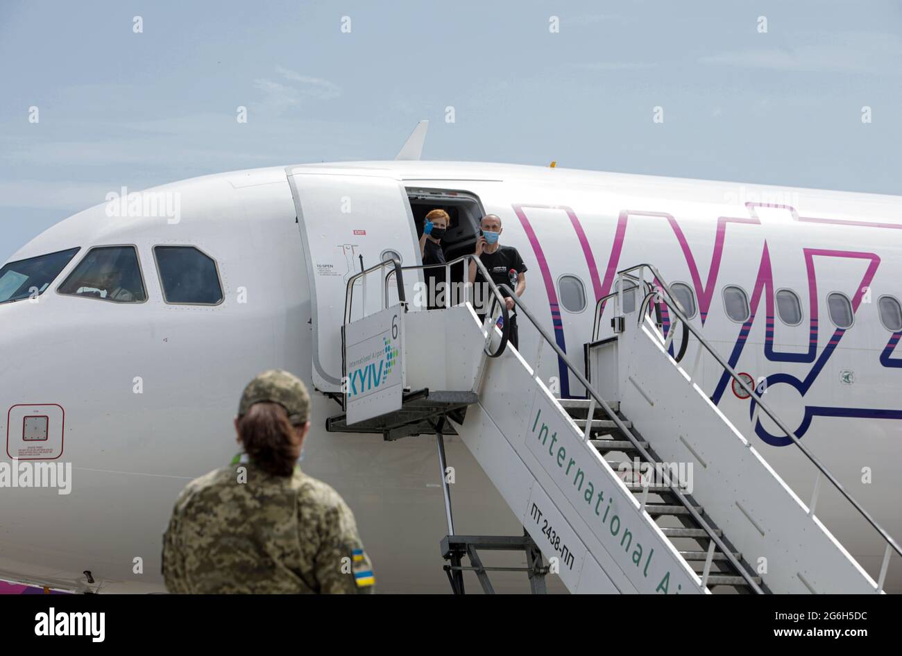 KYIV, UKRAINE - JUNE 24, 2021 - Passengers alight from a plane at the ...