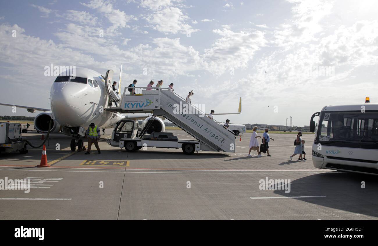 KYIV, UKRAINE - JUNE 24, 2021 - Passengers alight from a plane at the ...