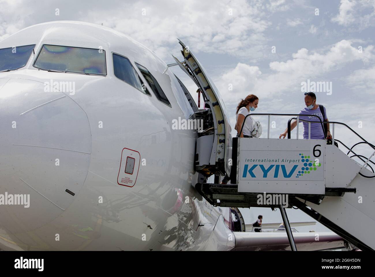KYIV, UKRAINE - JUNE 24, 2021 - Passengers alight from a plane at the ...