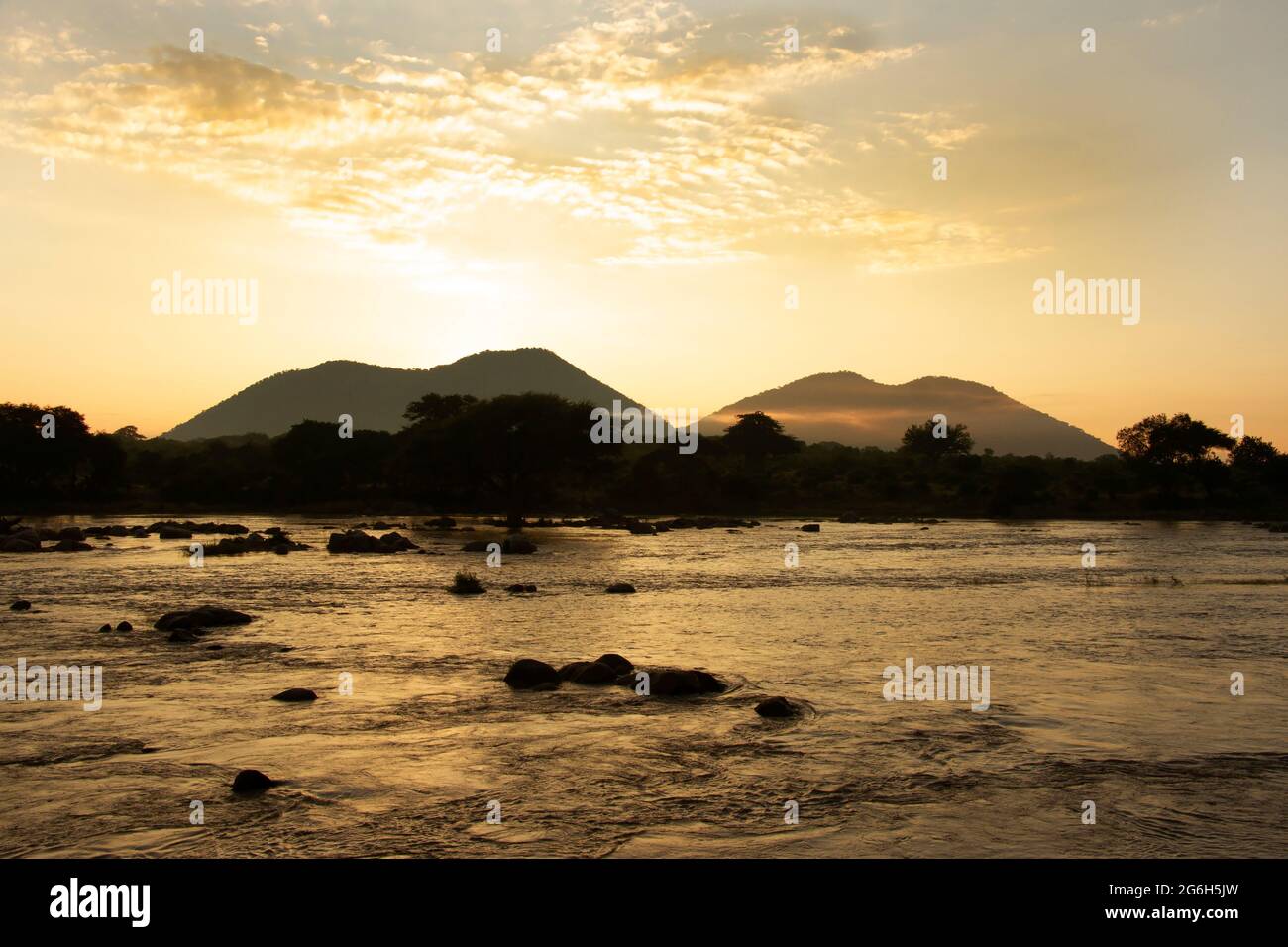Dawn breaks over the Great Ruaha River in Ruaha National Park. The ...