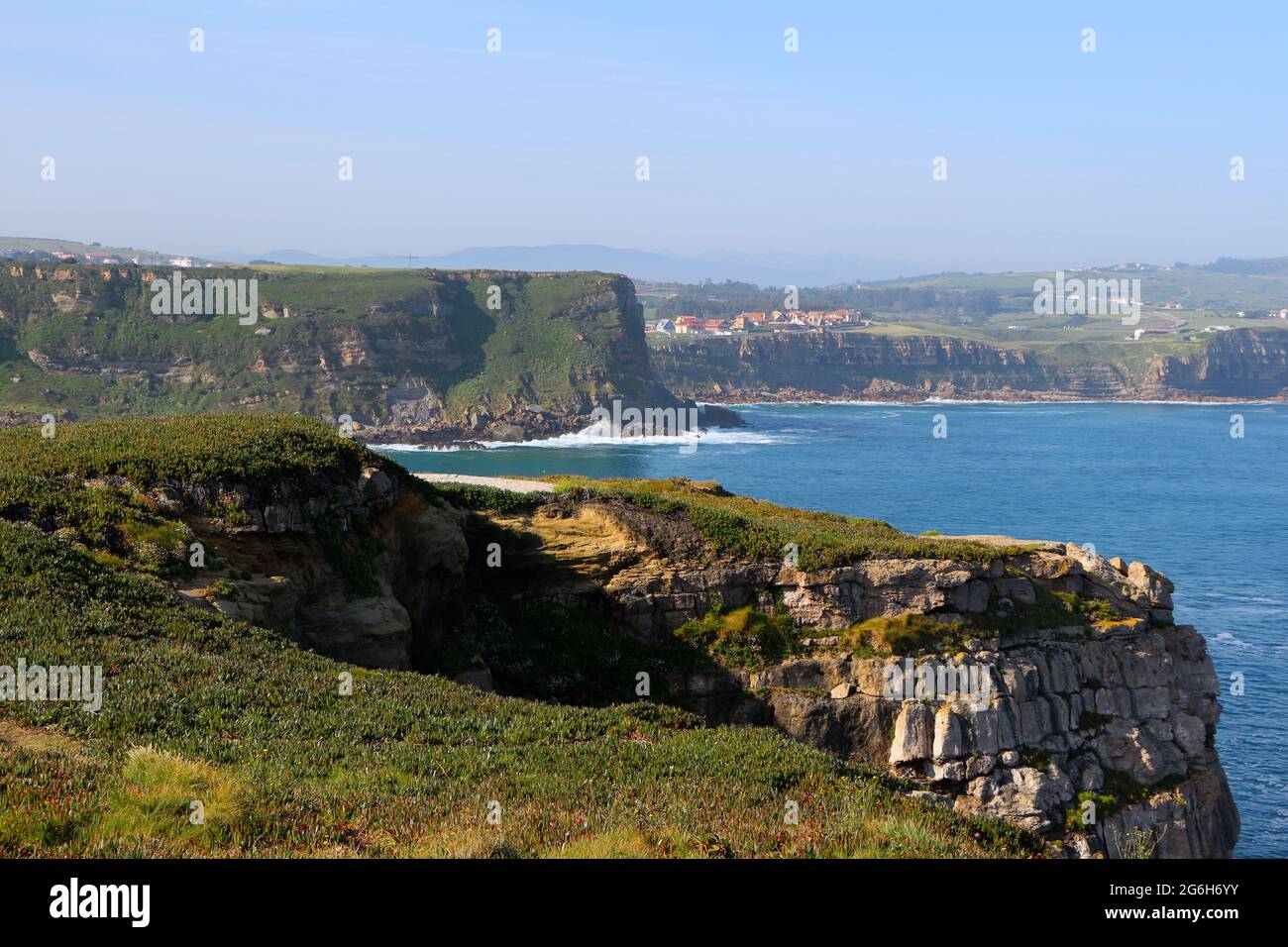 Rocky coastline with vertical cliffs Suances Cantabria Spain Stock ...