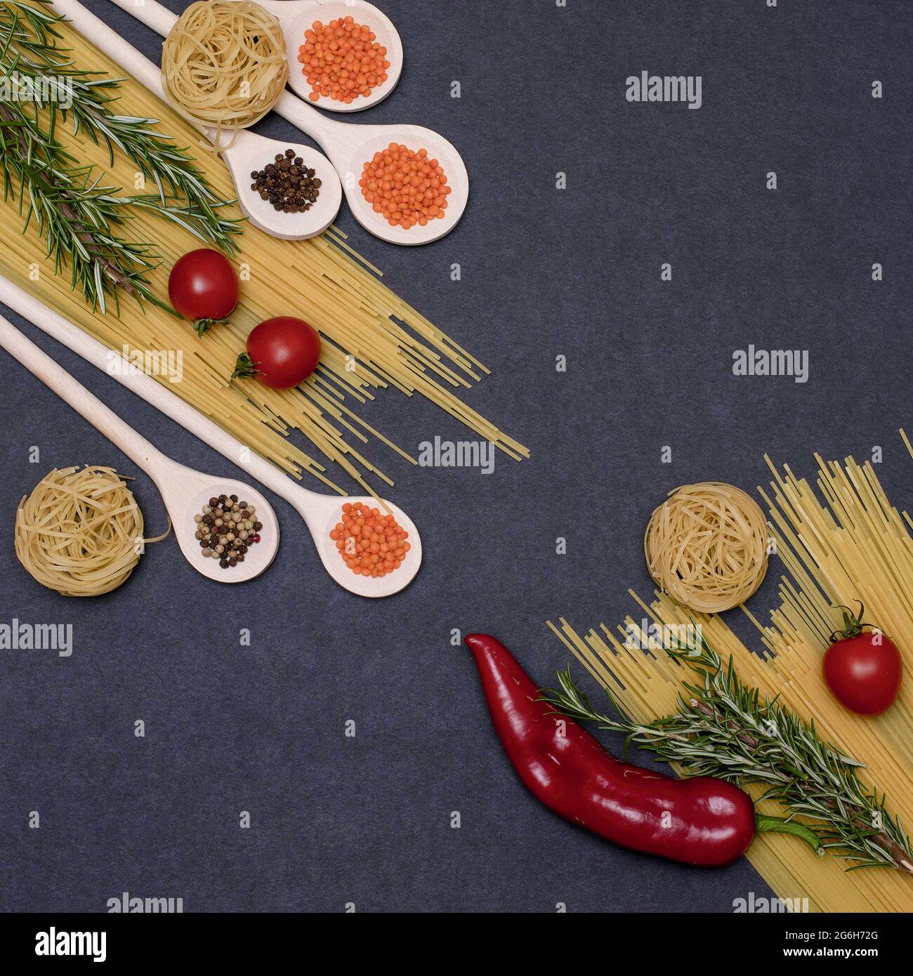 Italian food ingredients.Still life of cooking pasta on a black ...