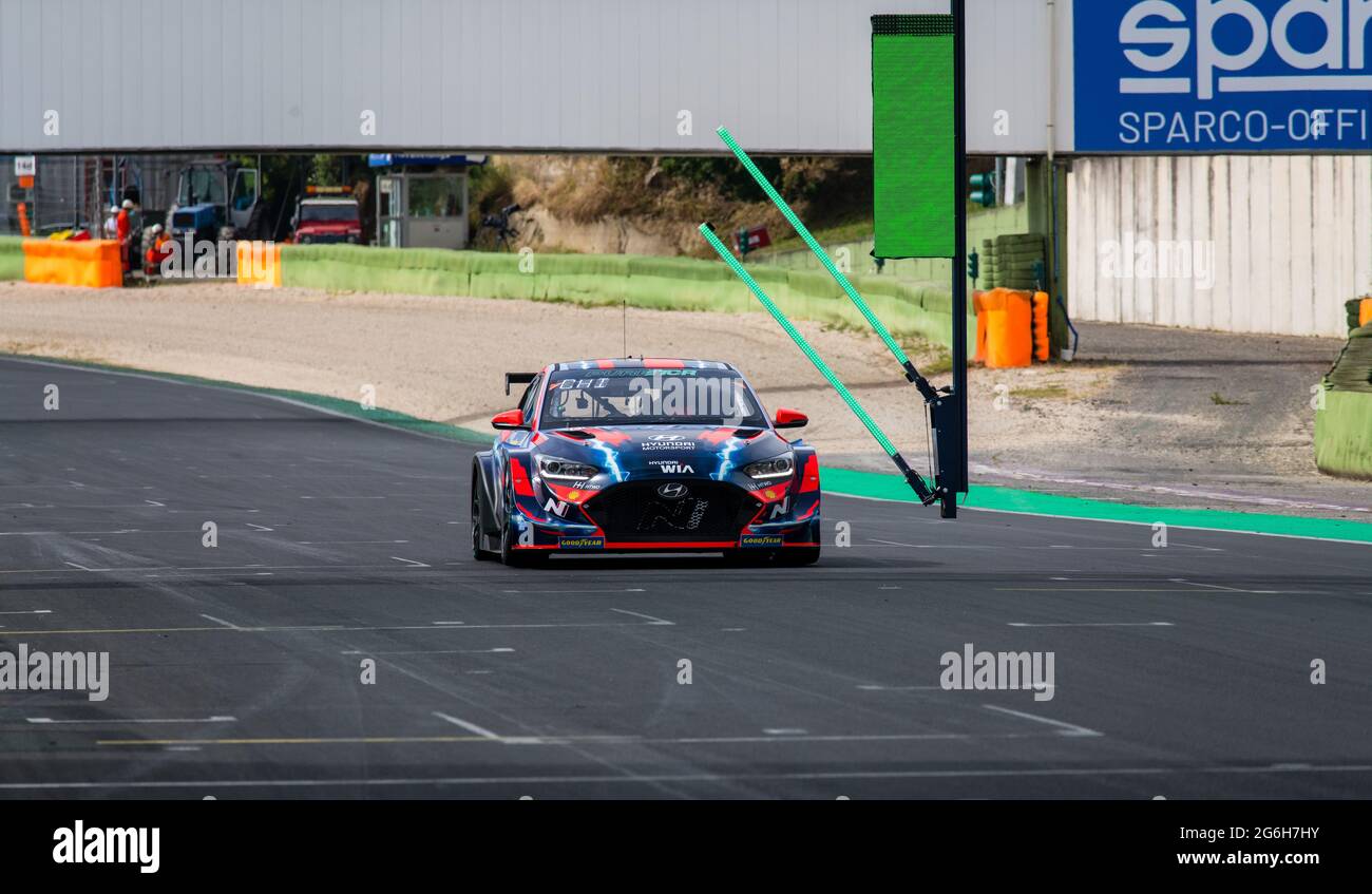 Electric car racing om racetrack starting line main straight Stock ...