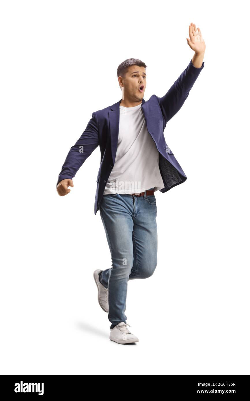 Full length shot of a man running, gesturing wait with hand and ...