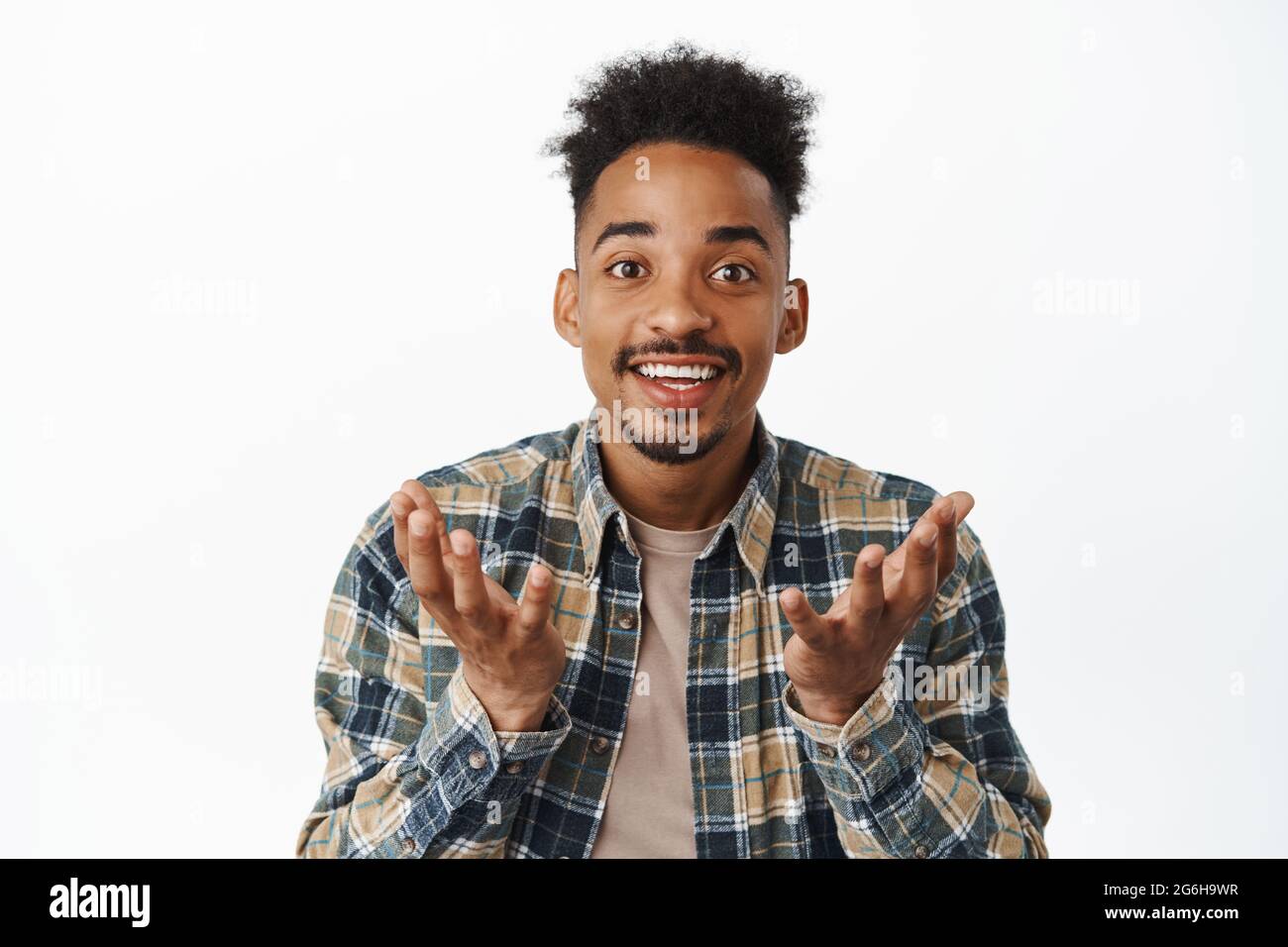 Close up portrait of happy african american man looking surprised and ...