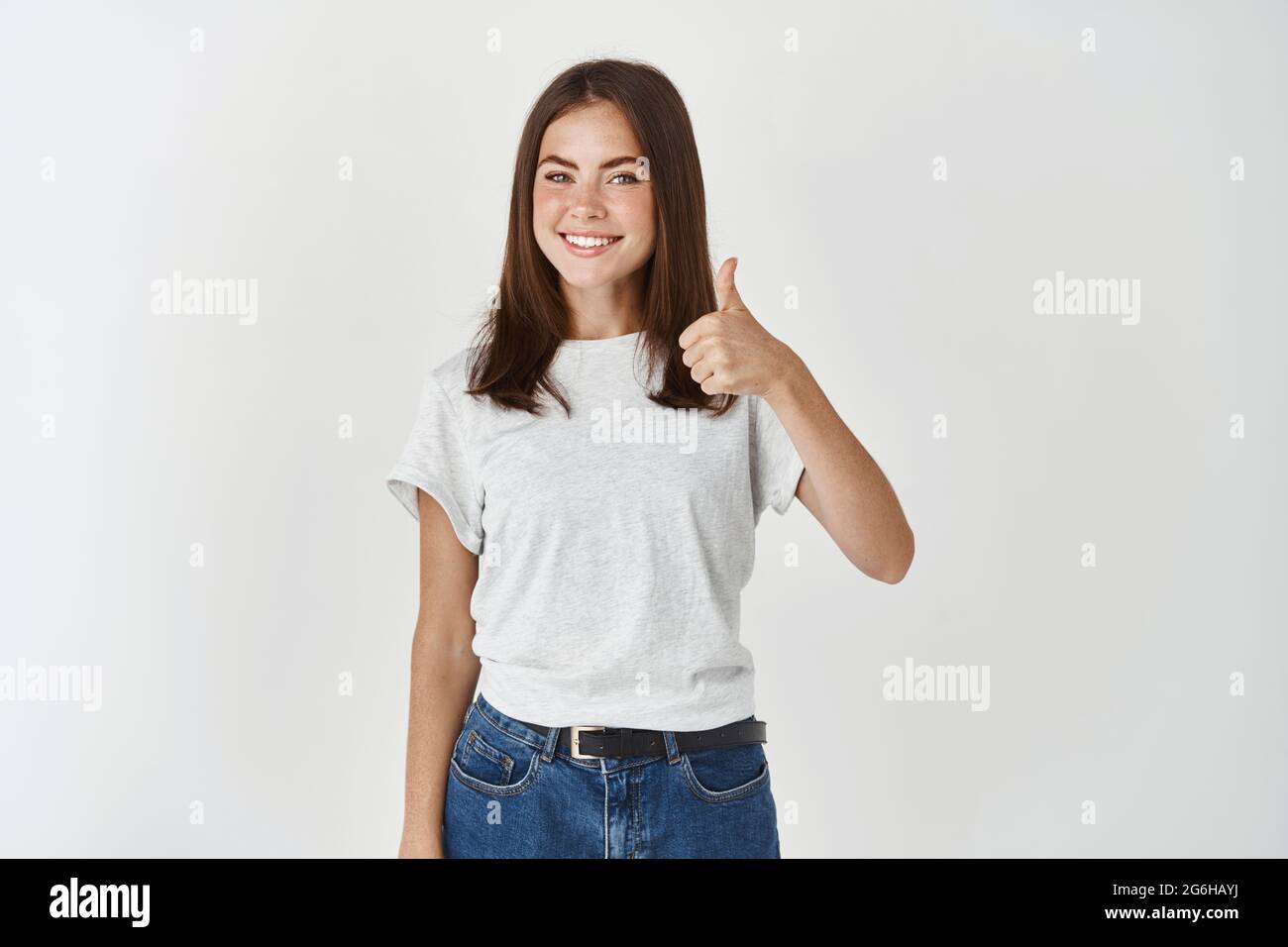 Satisfied female showing thumbs-up, say yes, recommending product ...