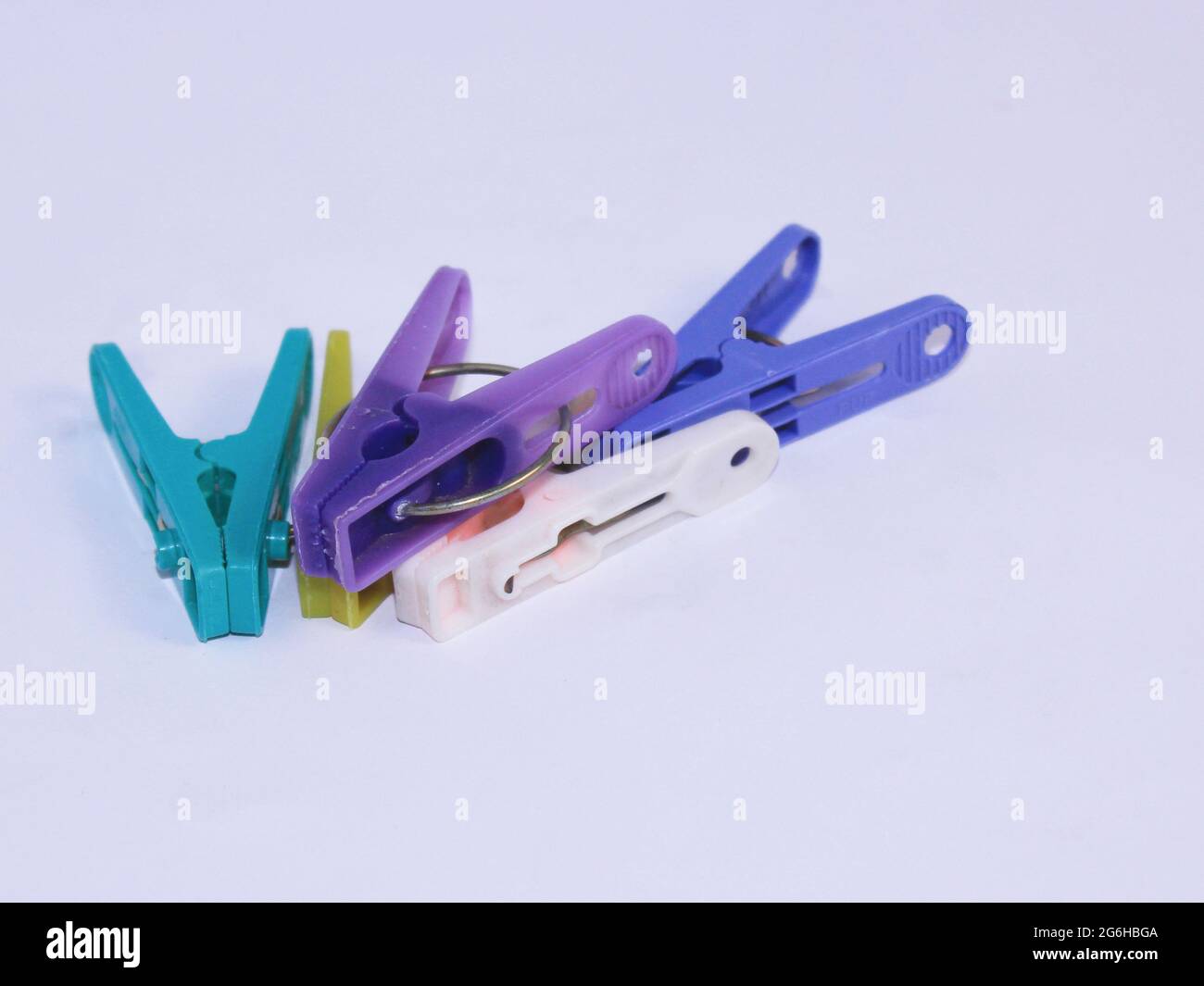 colorful of clothes peg white background Stock Photo - Alamy