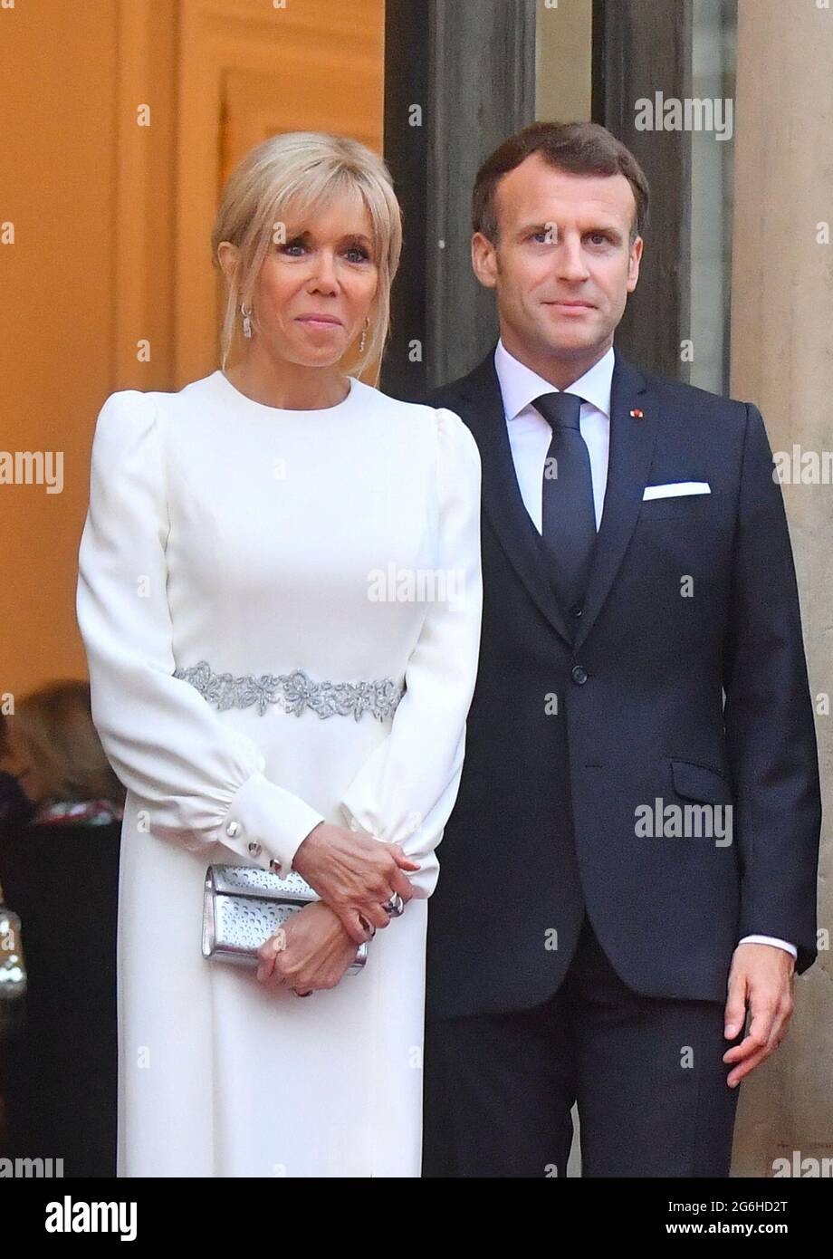 French President Emmanuel Macron and his wife Brigitte Macron pose for ...