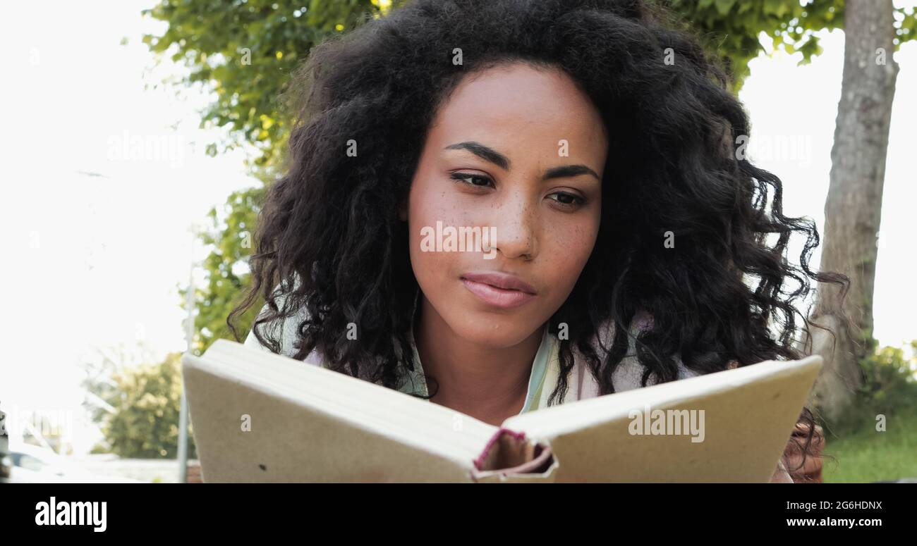African american woman reading book hi-res stock photography and images ...