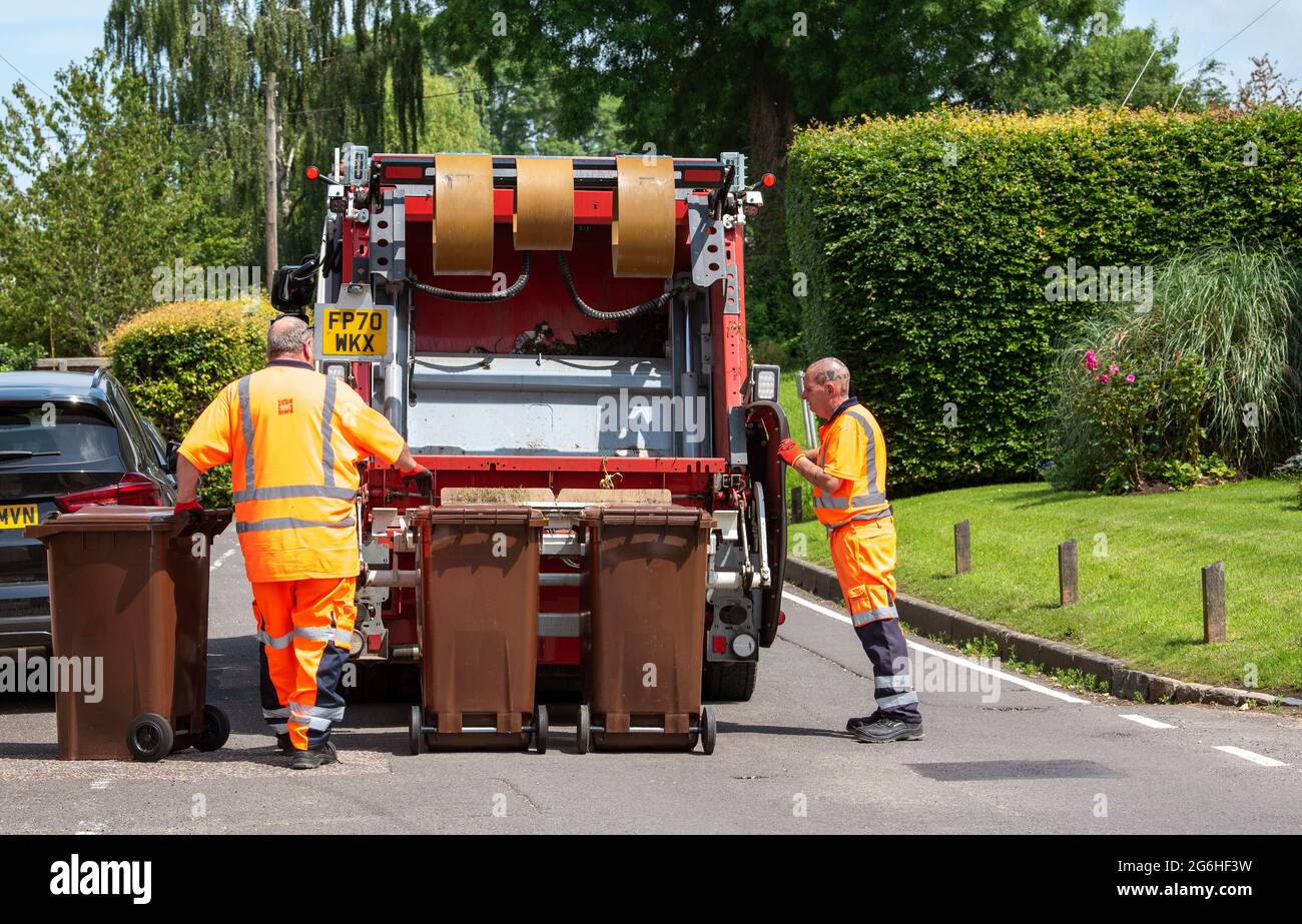 Hampshire, England, UK. 2021. Council operatives collect garden waste ...