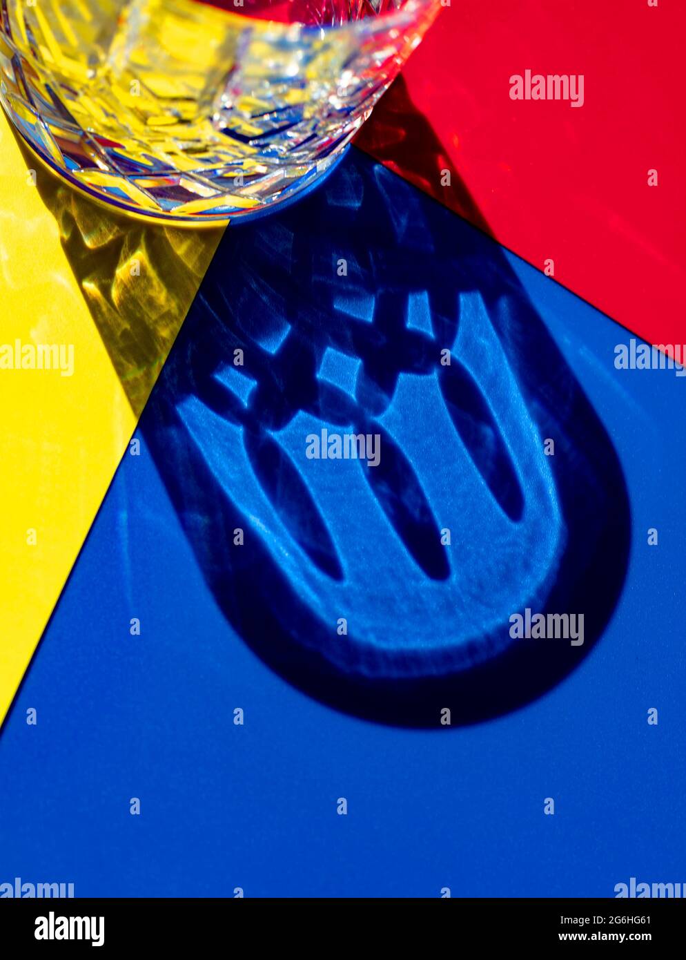 Still-life of crystal glass and prominent reflection pattern on ...