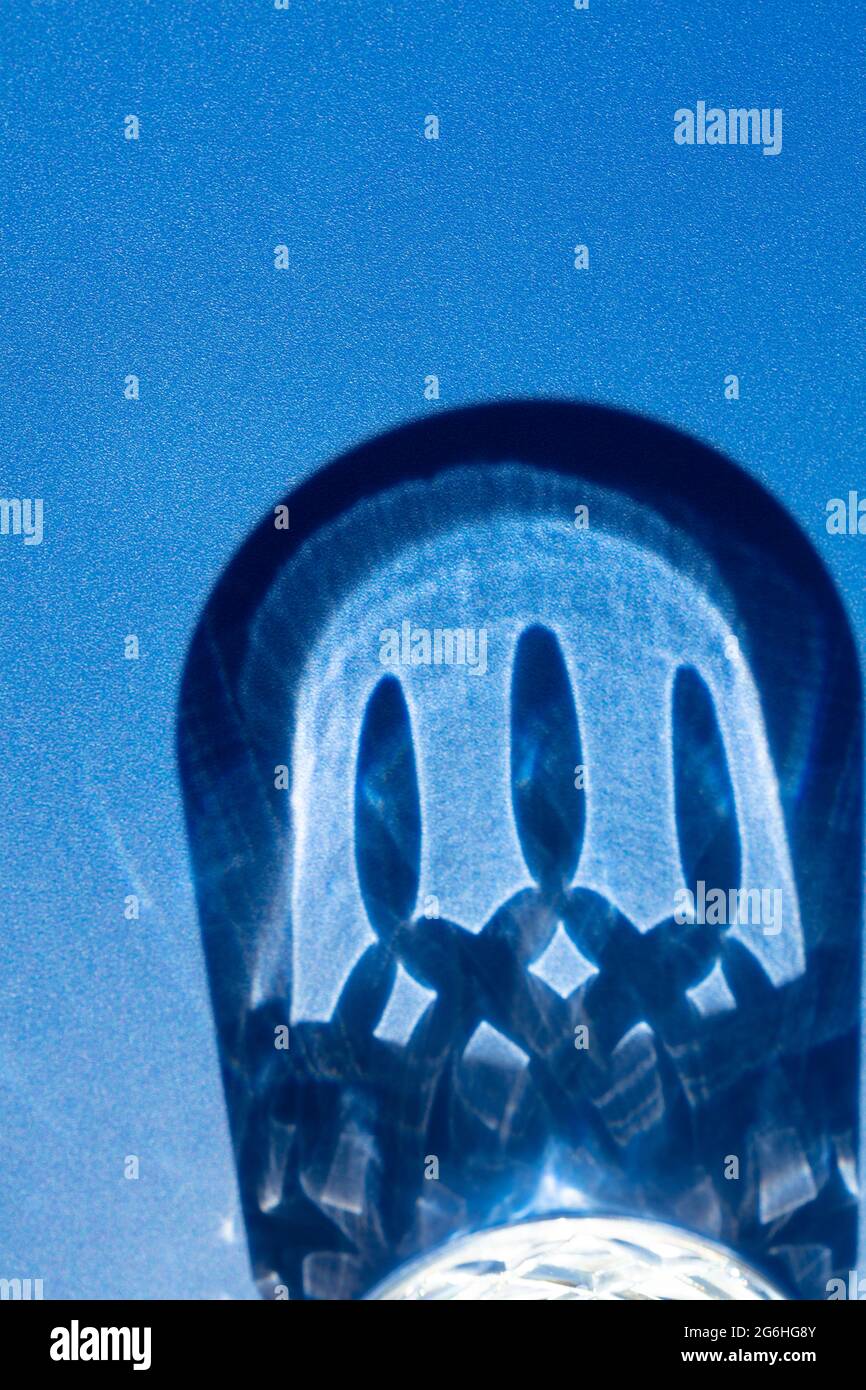 Still-life of crystal glass and prominent reflection pattern on ...